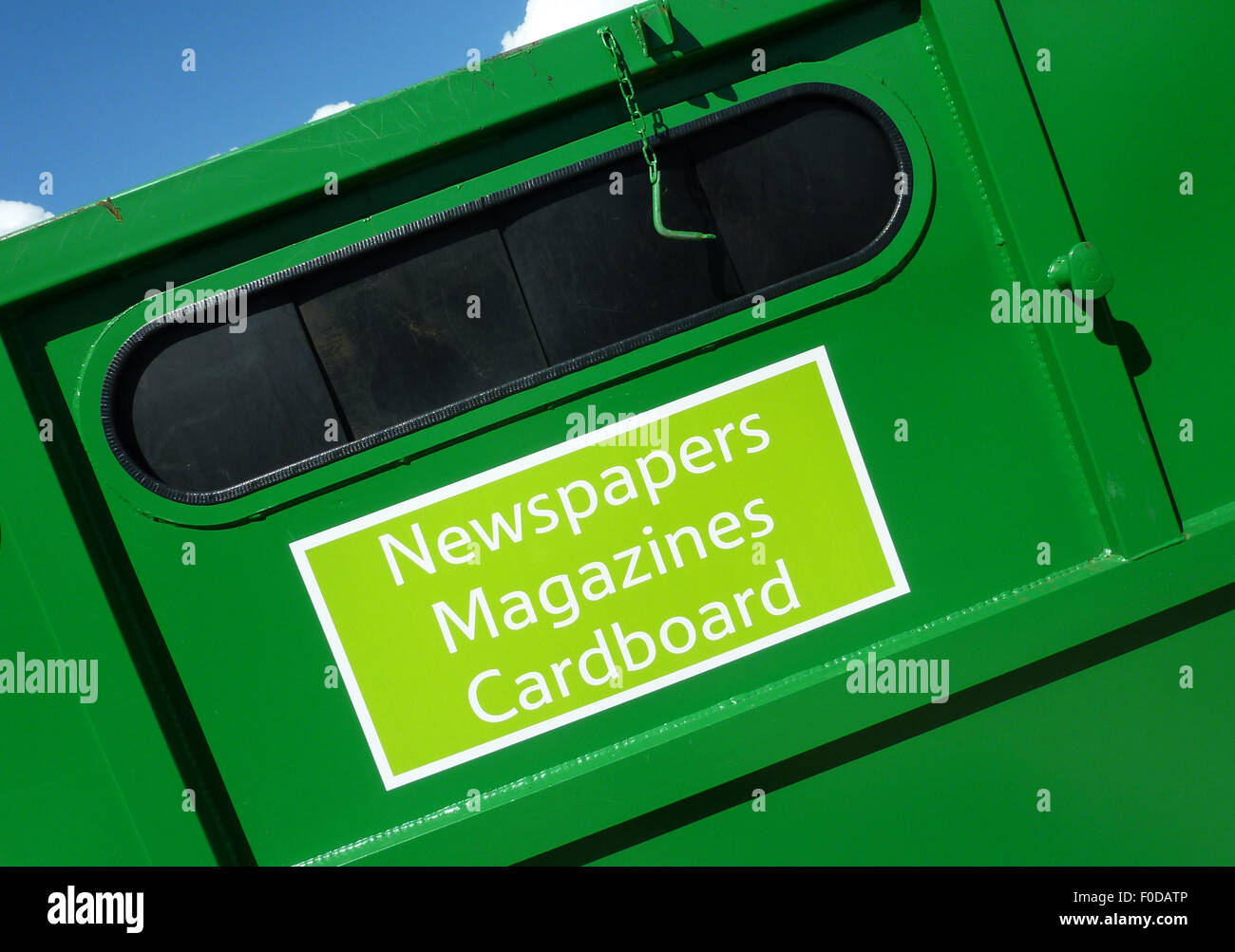 Closeup of green colored paper waste container Stock Photo - Alamy