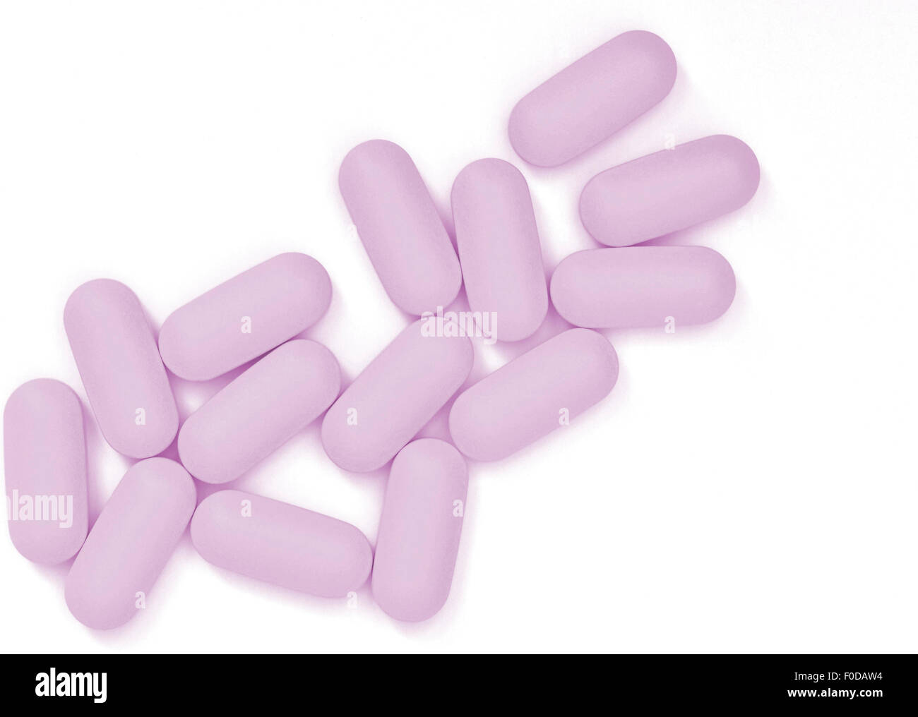 Closeup of vitamin tablets over white background Stock Photo - Alamy