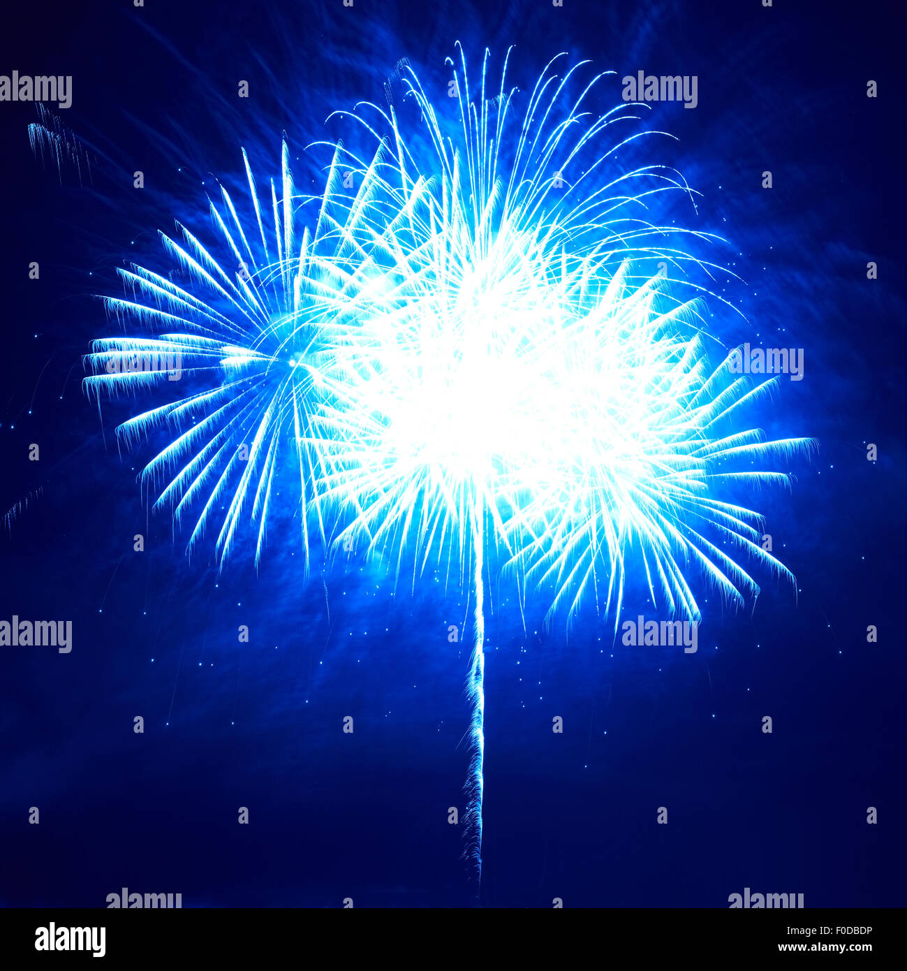 Blue colorful fireworks on the black sky background Stock Photo - Alamy