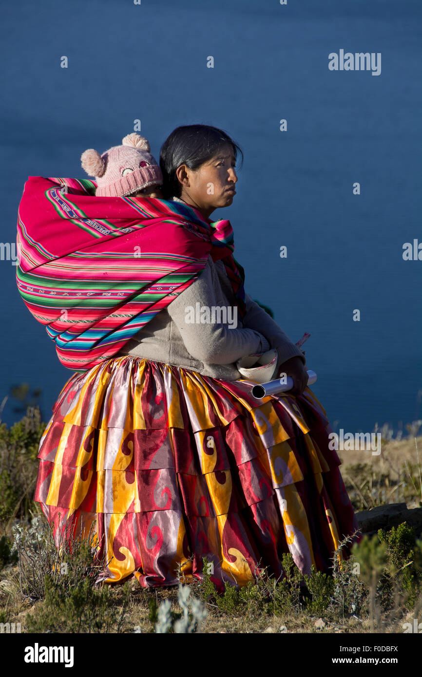 Indio woman with a young child on her back, traditional clothing, in ...