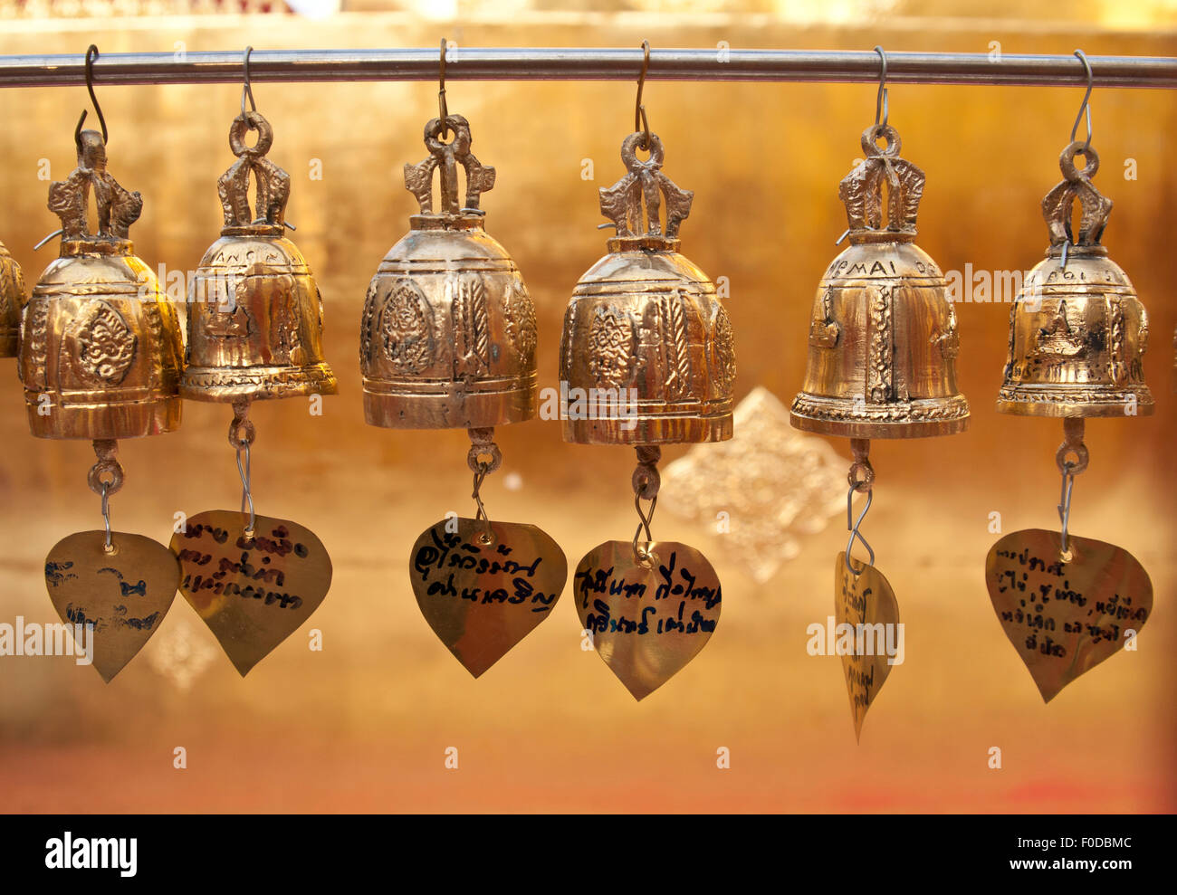 Golden bells hanging from a pole as an sacrifice, Wat Phra That Doi ...