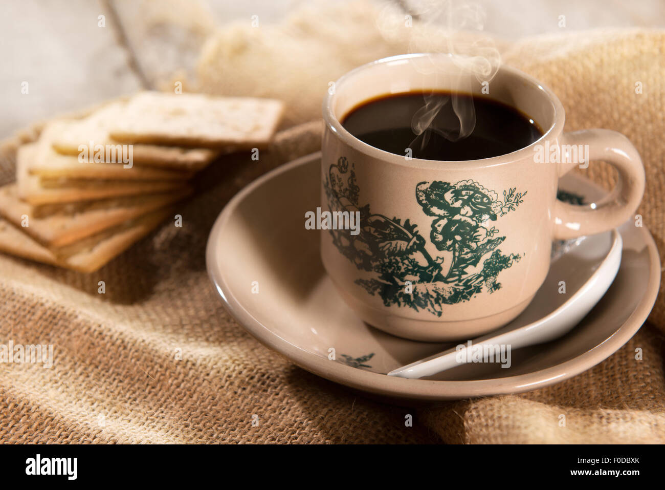 Steaming traditional oriental Chinese kopitiam style dark coffee in ...