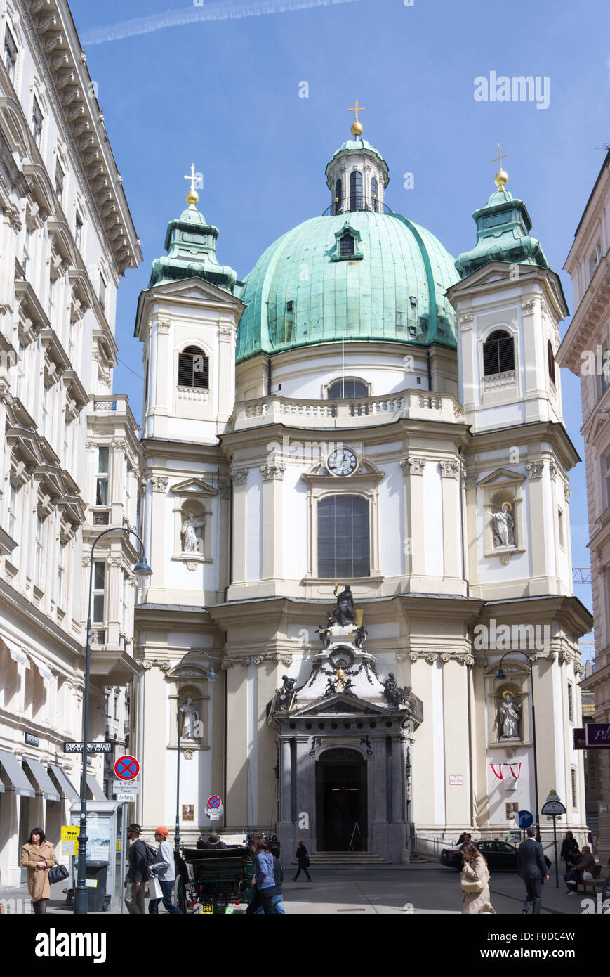 Tourists visit St. Peter's Church in Vienna, Austria, to admire its ...