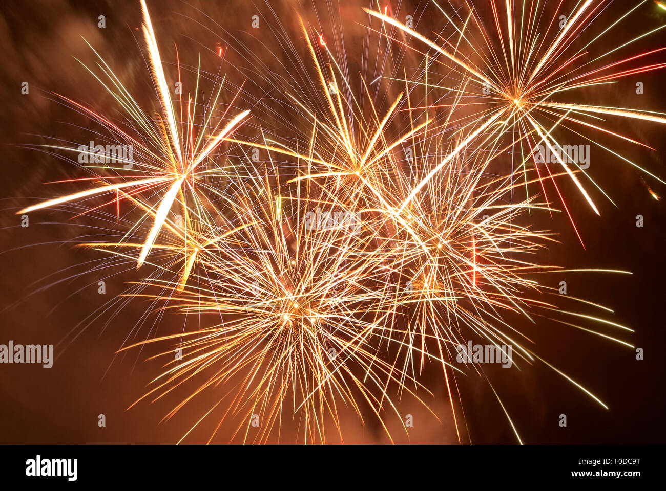 Red colorful fireworks on the black sky background. Holiday celebration ...
