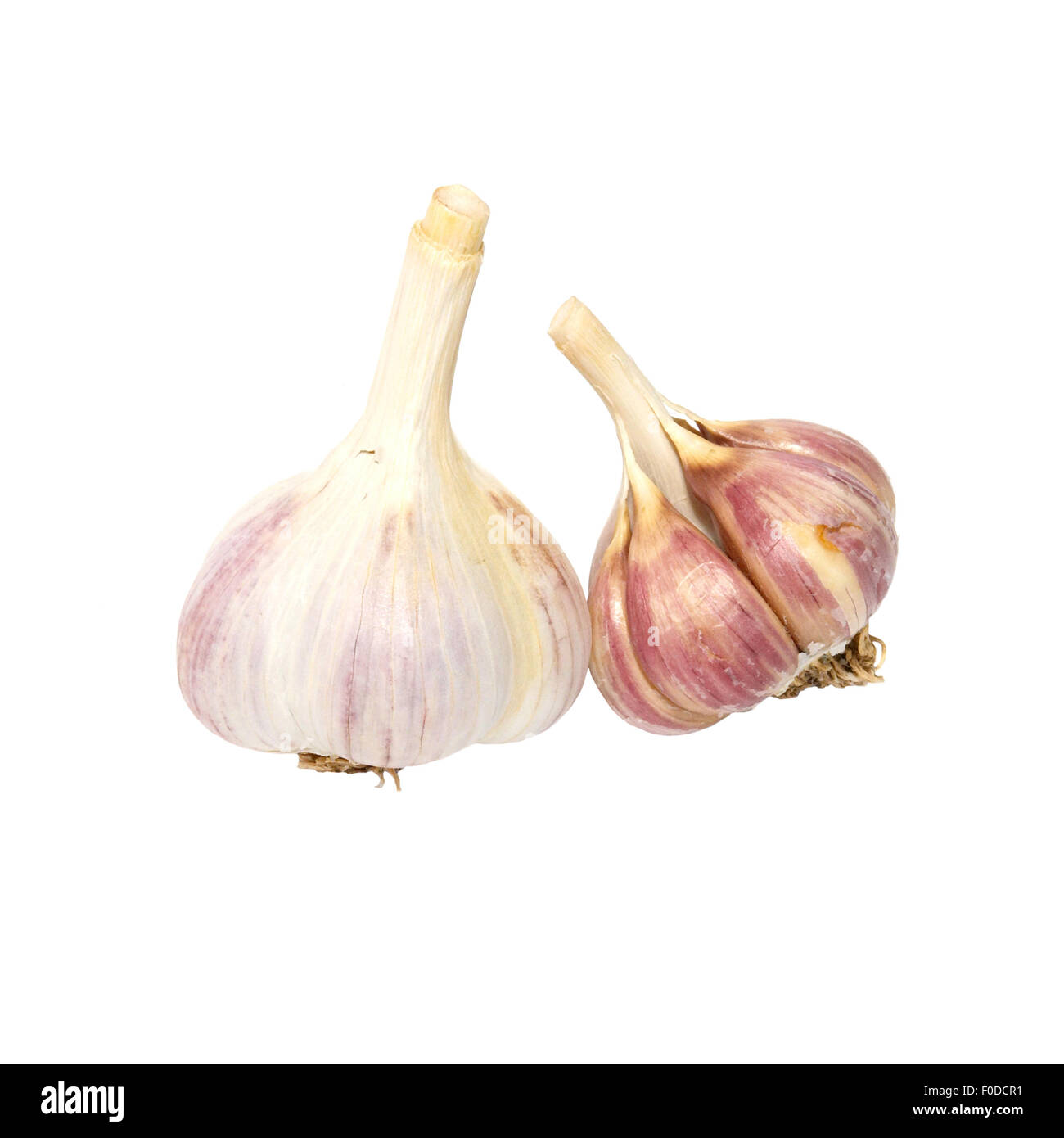 Two garlic cloves isolated on white Stock Photo - Alamy