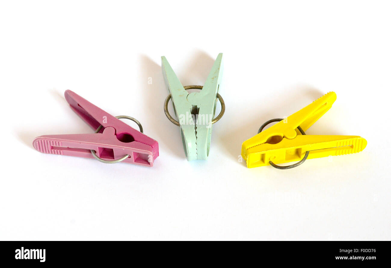 Colored clothes-pegs isolated on white Stock Photo - Alamy