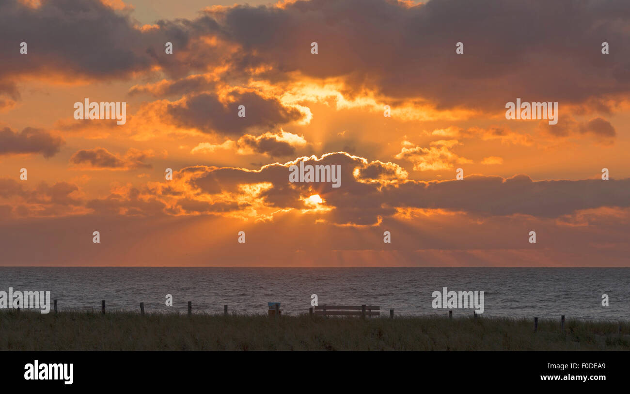 Crepuscular rays or sun rays over the North Sea, one evening in summer ...