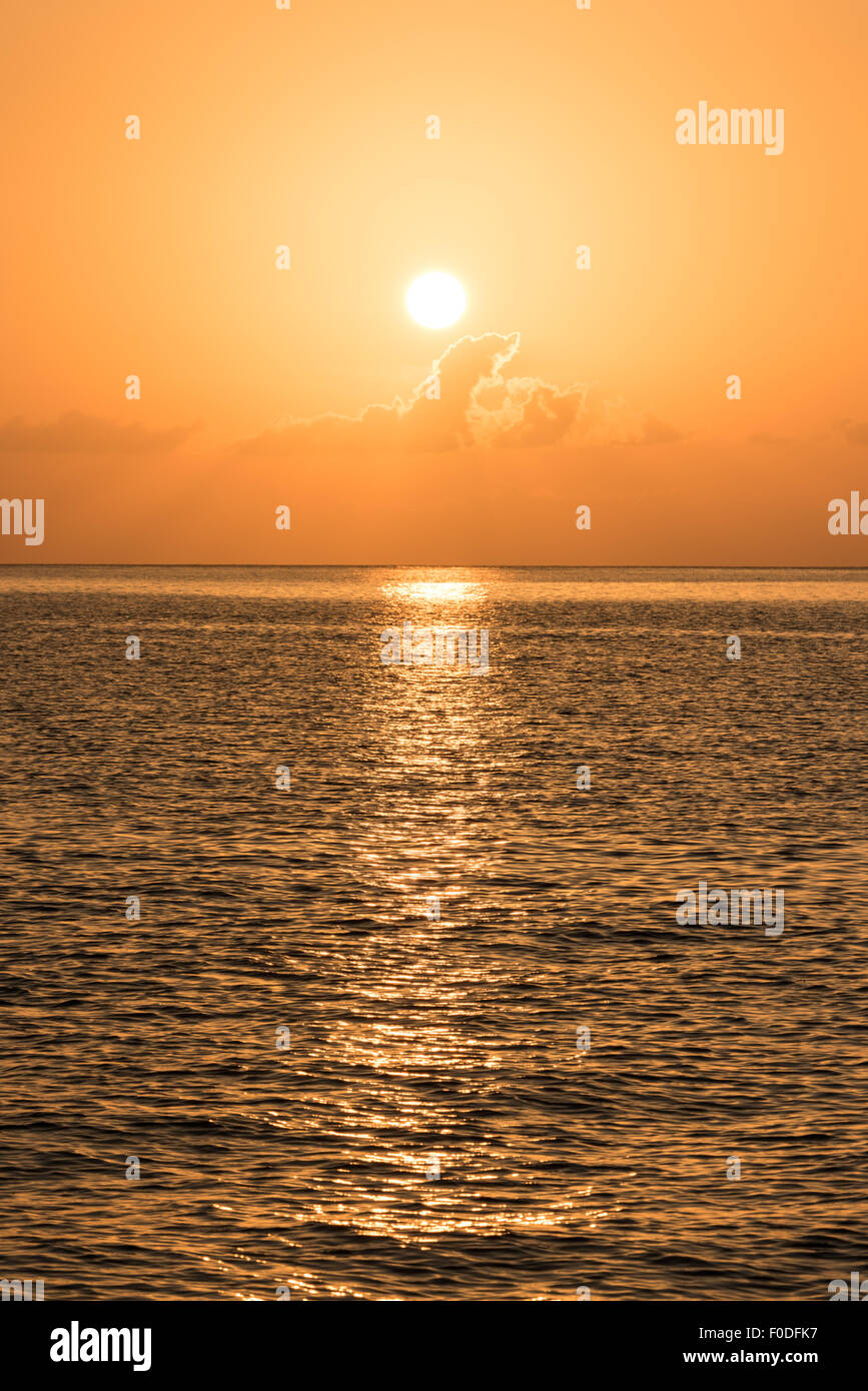 Beautiful tropical sunset ocean background. Vertical shot Stock Photo ...