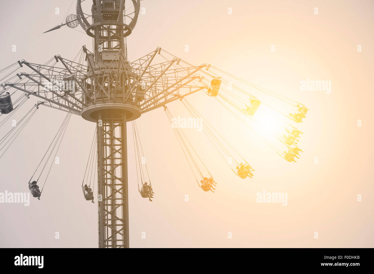 flying swing in theme park Stock Photo - Alamy
