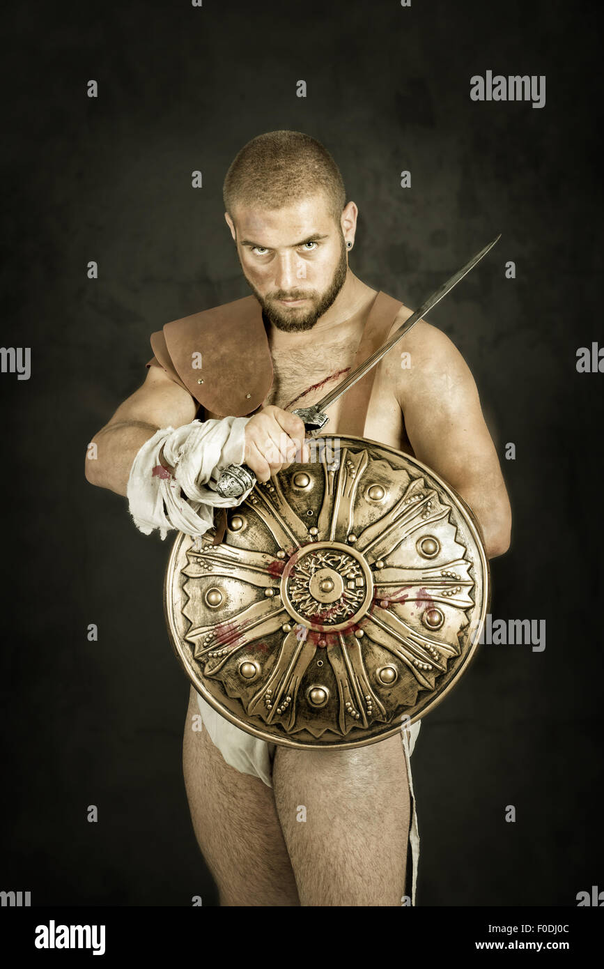 Gladiator warrior posing shield sword hi-res stock photography and ...