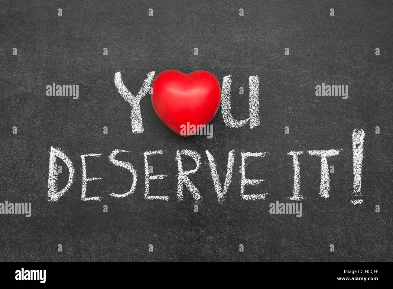 you deserve it exclamation handwritten on chalkboard with heart symbol ...