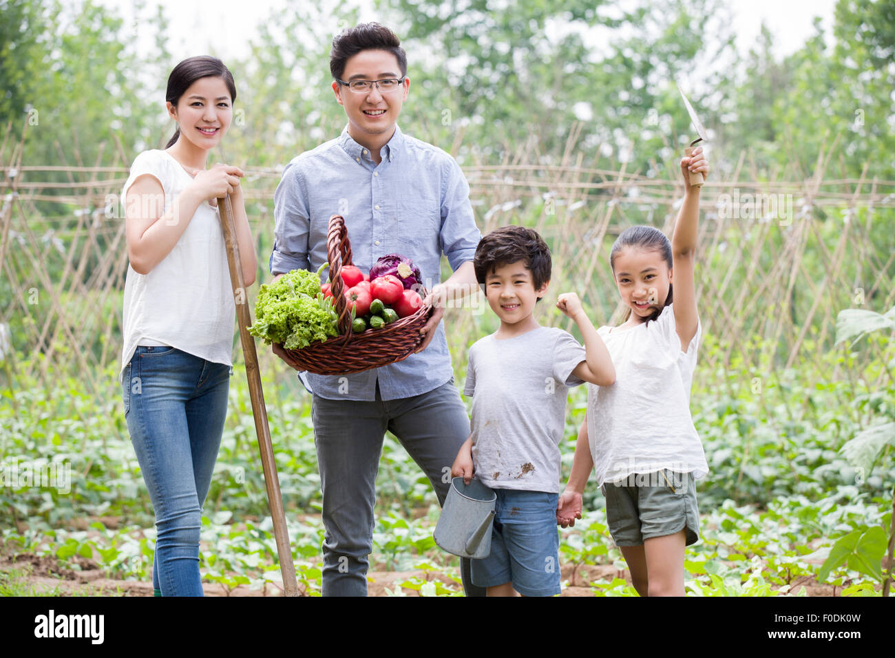 Young family gardening together Stock Photo - Alamy