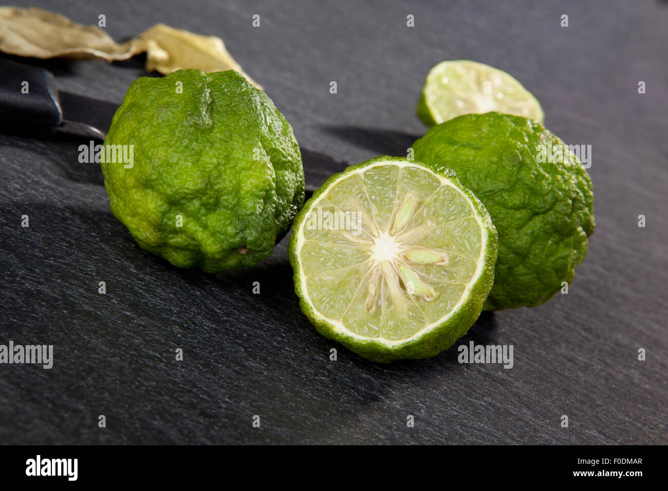 Ripe bergamot fruit on black background. Culinary cooking ingredient ...