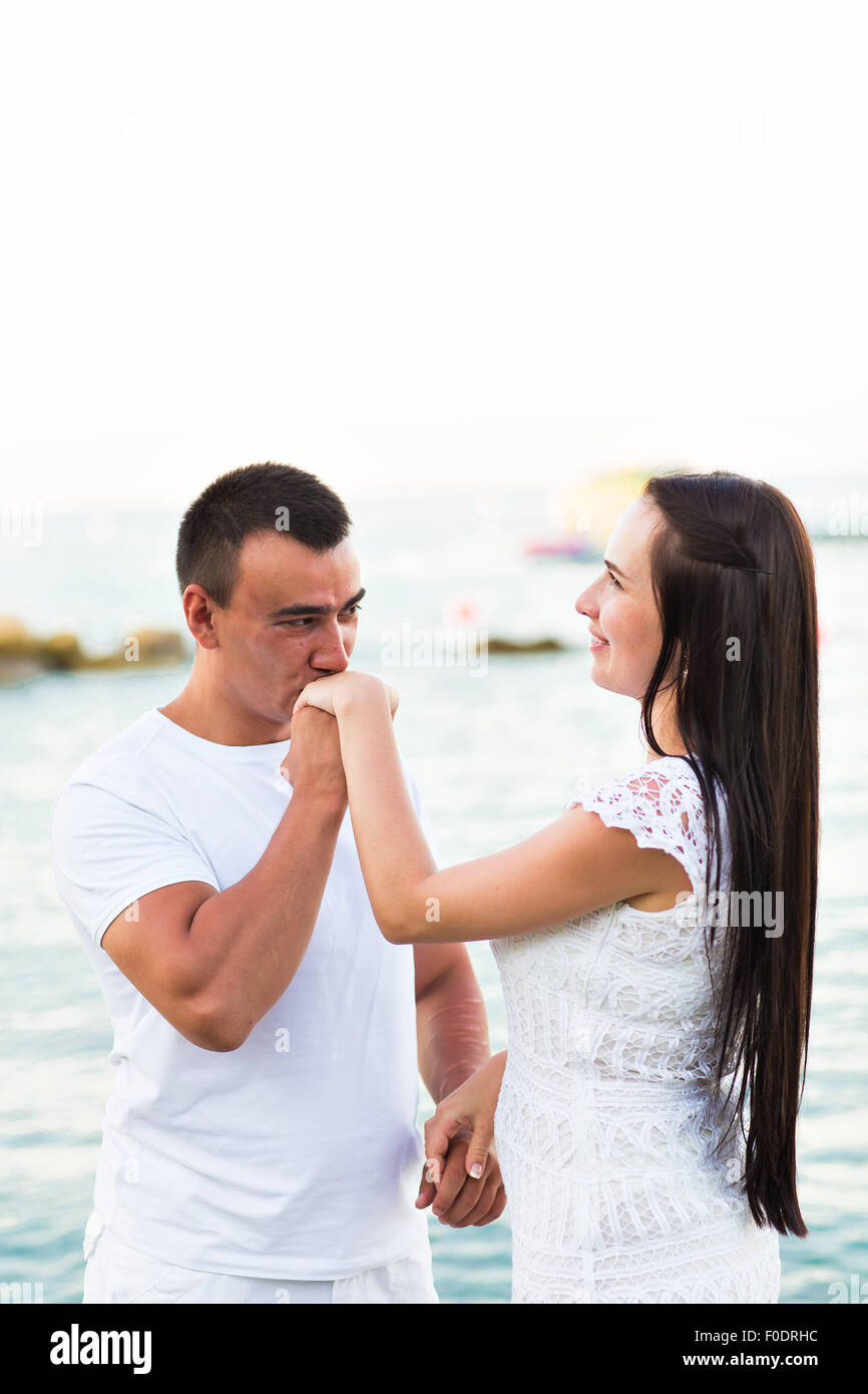 Boyfriend kiss girl hand Stock Photo - Alamy
