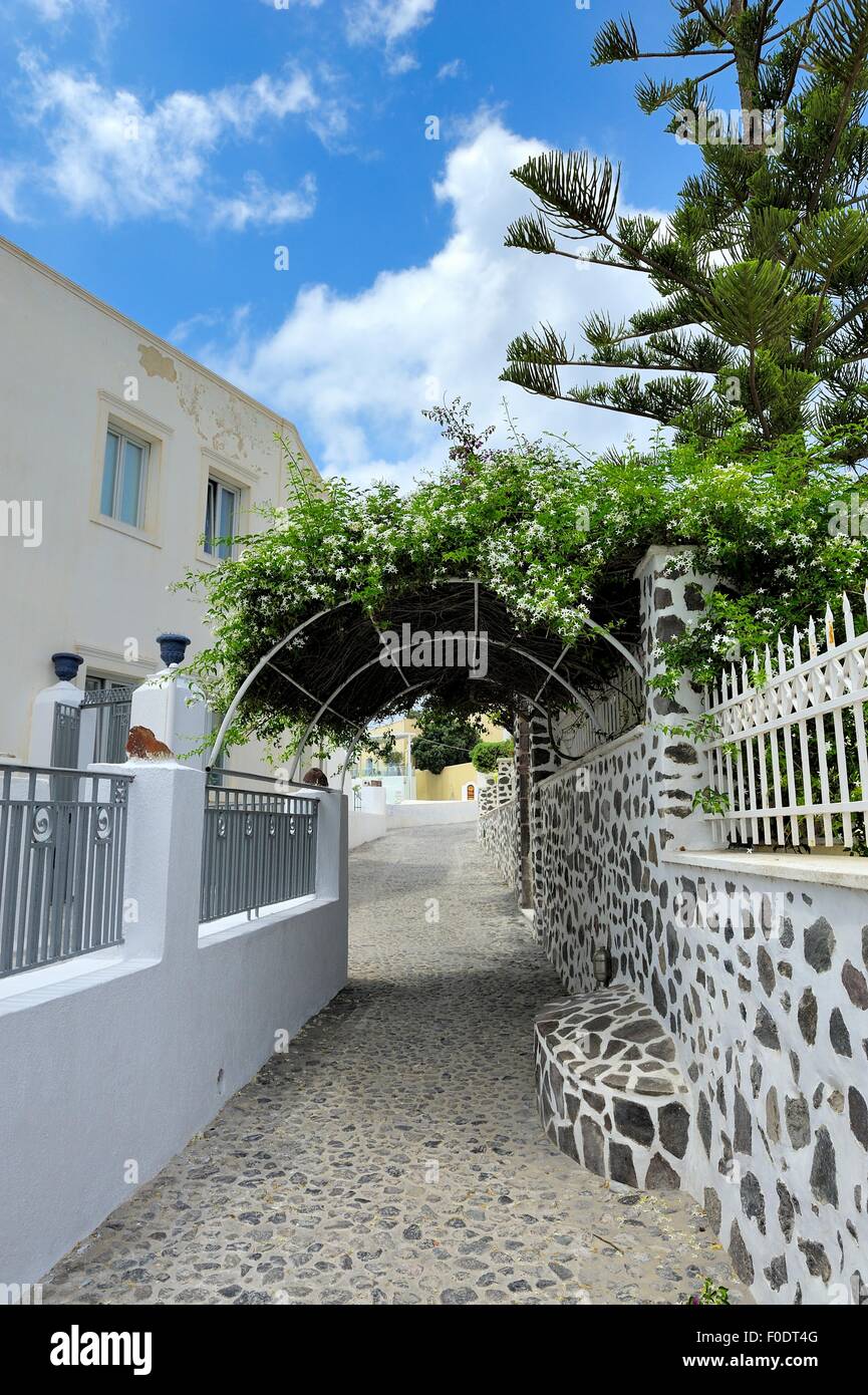A covered walkway in Fira Santorini greece Stock Photo - Alamy