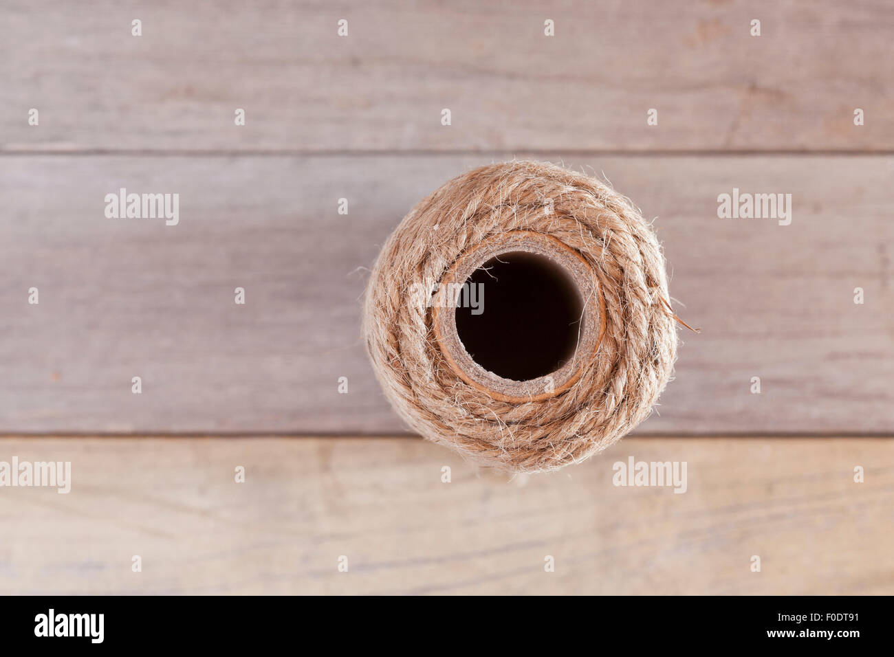 An old cord over a wooden table Stock Photo - Alamy