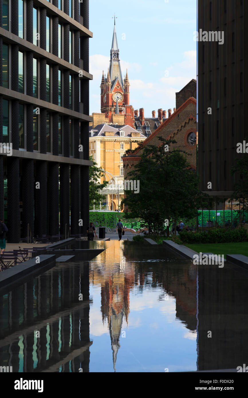 Clock Tower of St Pancras Station reflected in the steped water feature ...
