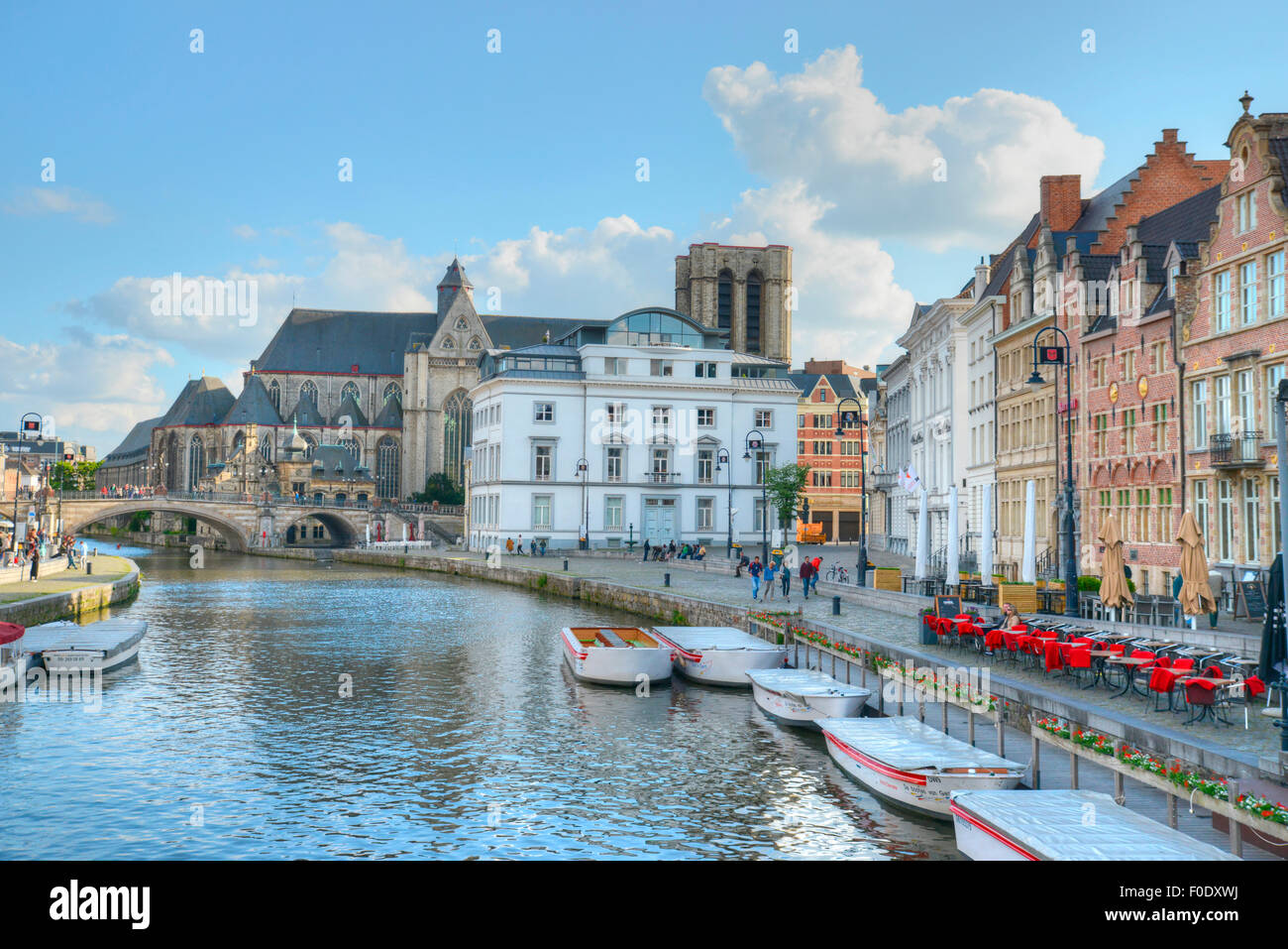 Beautiful canal at Ghent with river boats and medieval buildings Stock ...