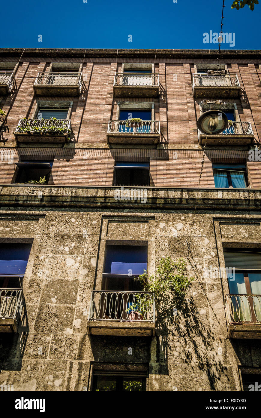 Exterior of a traditional multi-storey Milanese building. Milan, Italy ...