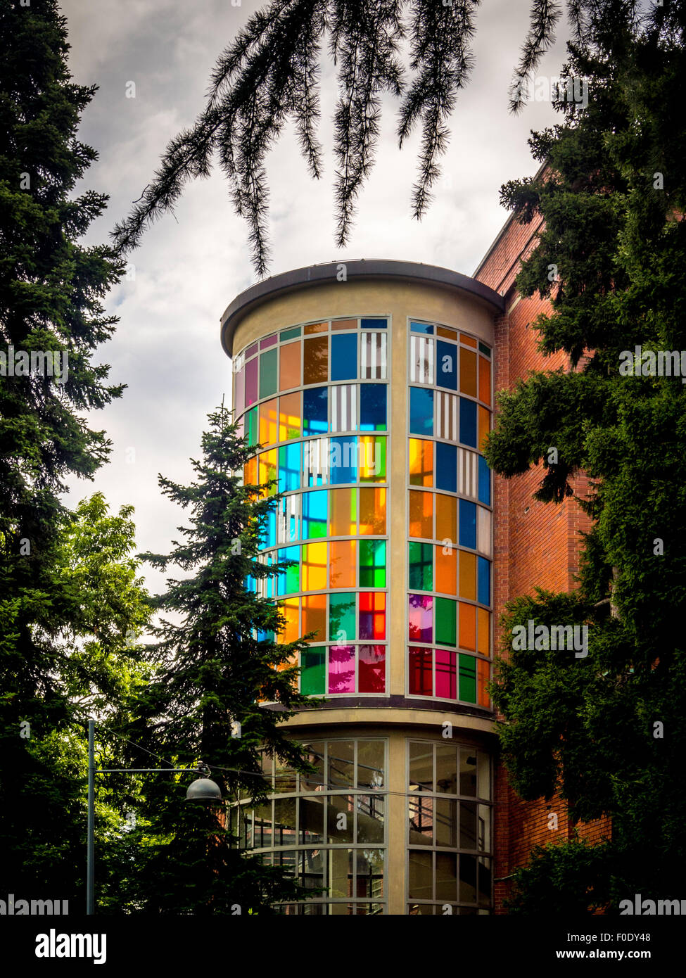 Circular building with coloured glass. Milan, Italy Stock Photo - Alamy