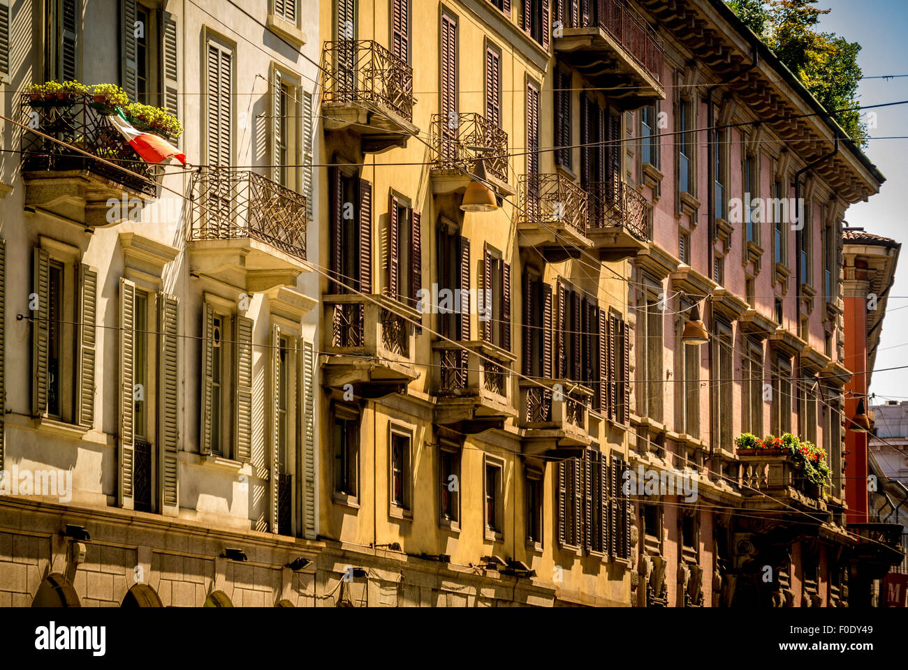 Traditional building with wooden window shutters in Milan, Italy Stock ...