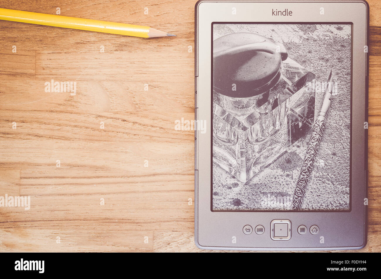 electronic reading device on a natural wood background - e-book reader ...