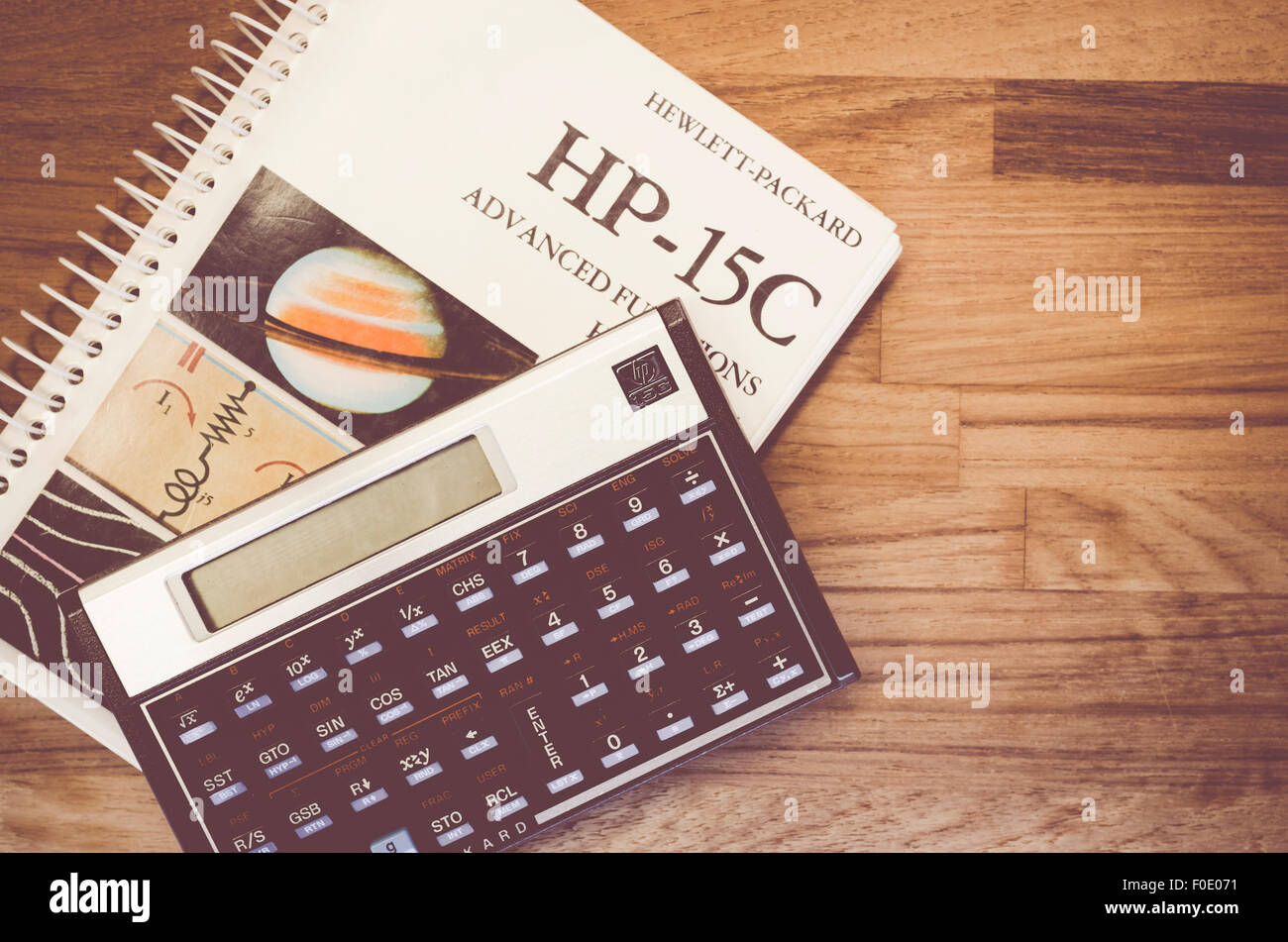 HP-15C Hewlett-Packard rpn scientific calculator and manual on a ...