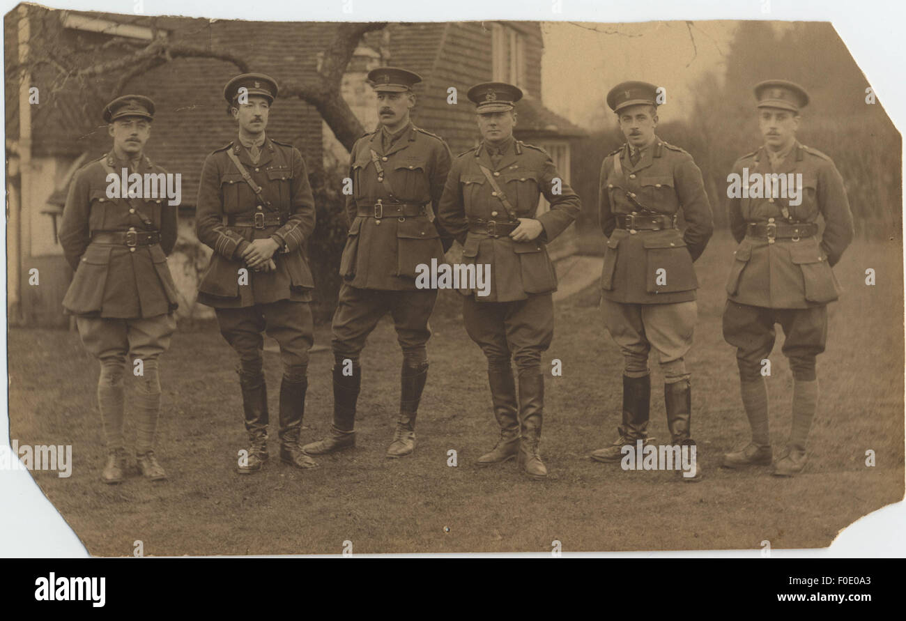 This historical photograph captures artillery officers alongside ...