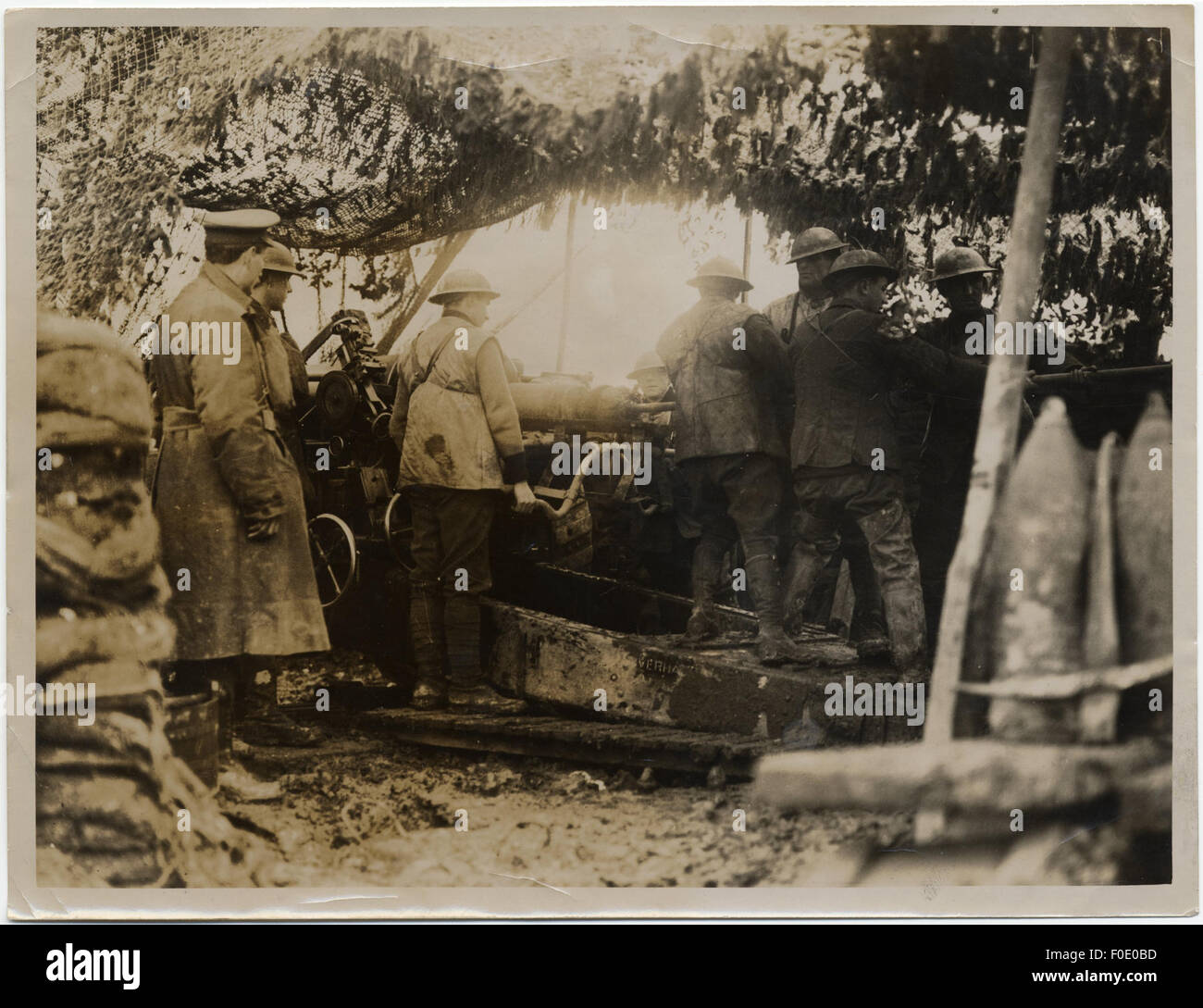 A historical image shows a Canadian siege gun being loaded, likely in a ...