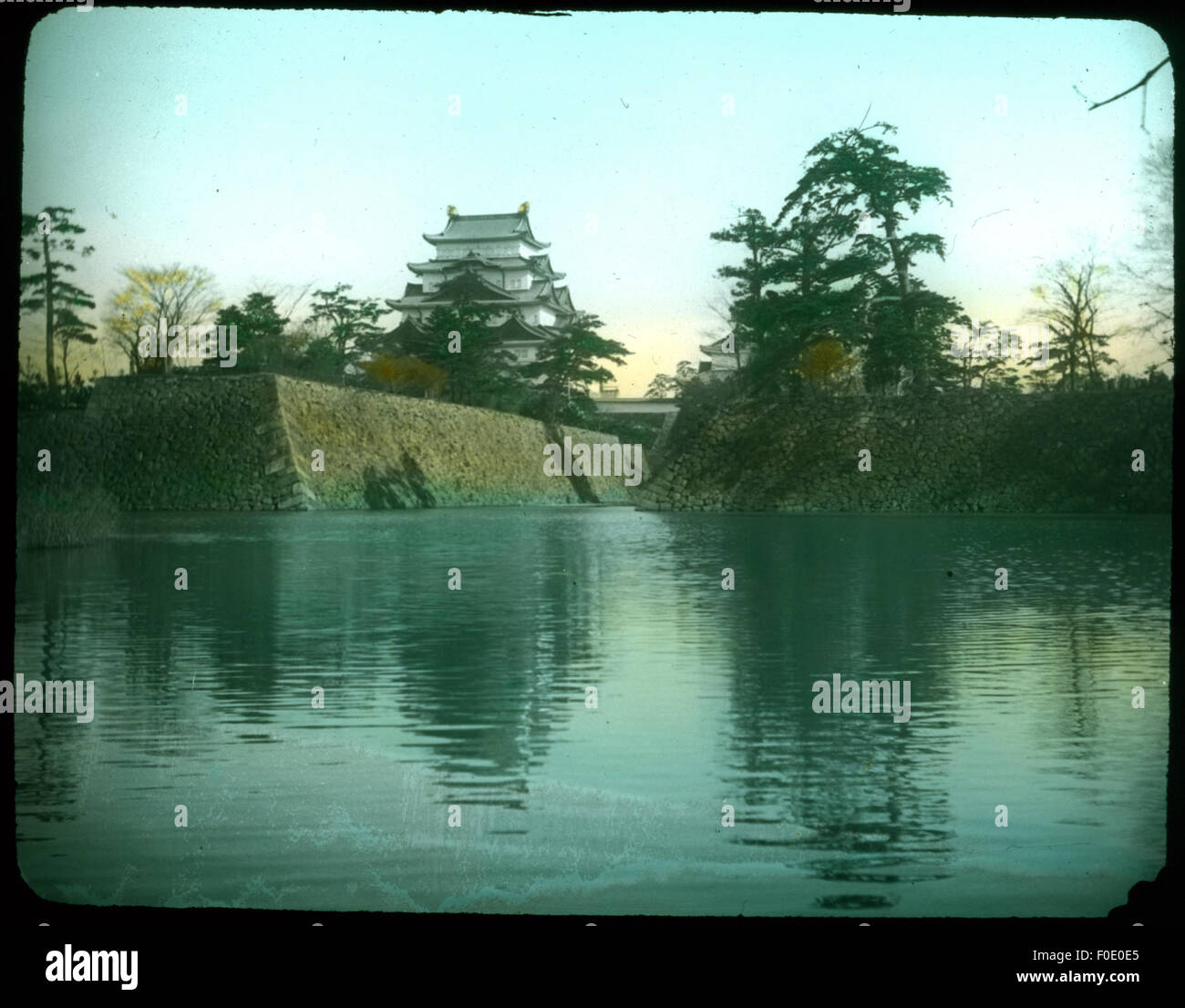 The high stone embankments above the river, with a line of trees ...