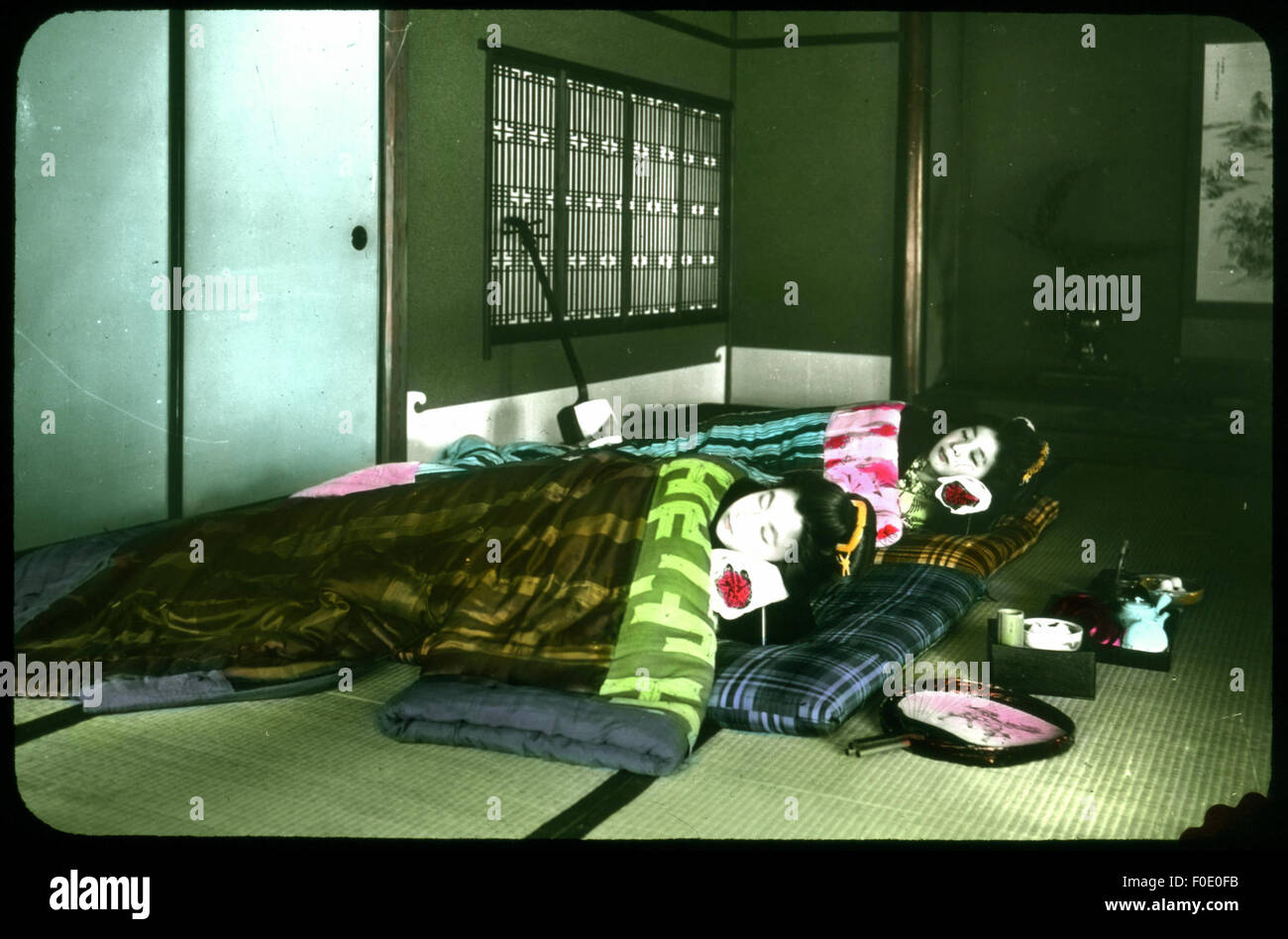 A serene interior shot featuring two geishas resting in traditional ...