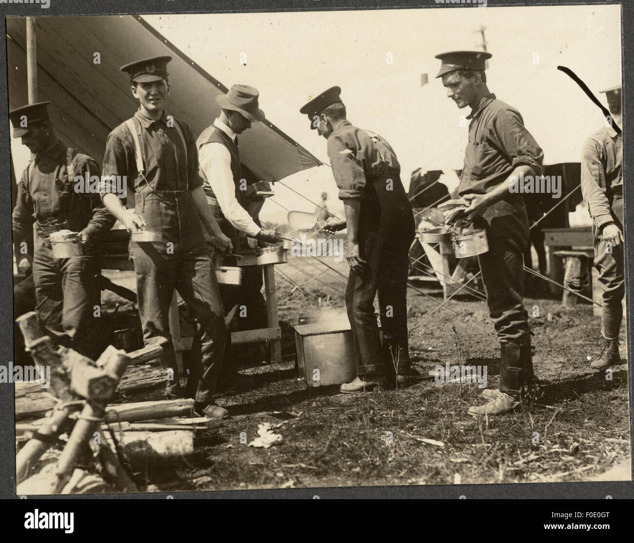 A group of soldiers receives their rations in this image, captured for ...