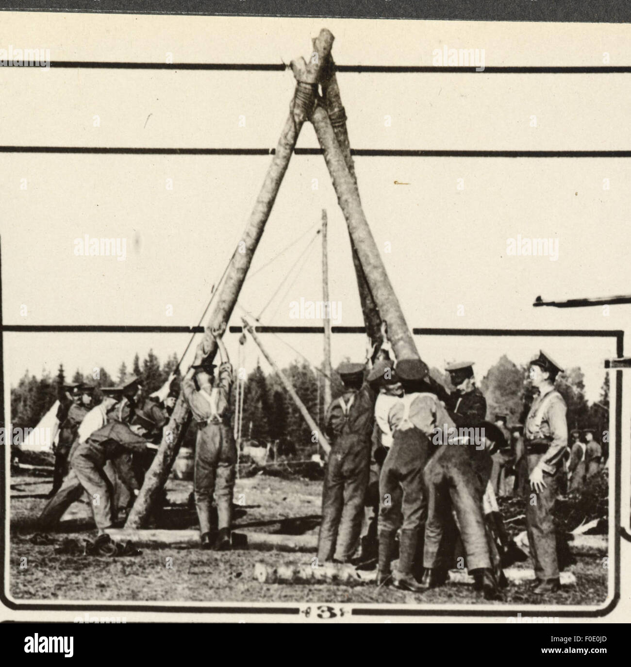 Canadian engineers are seen constructing a derrick and bridge, part of ...