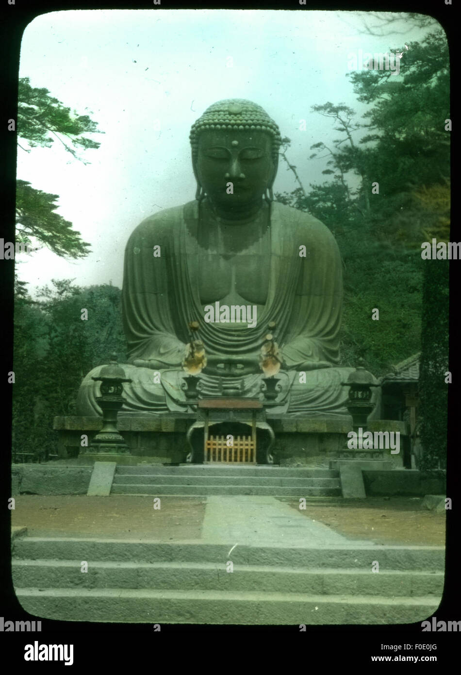 A large stone Buddha statue, often found in temples or outdoor settings ...