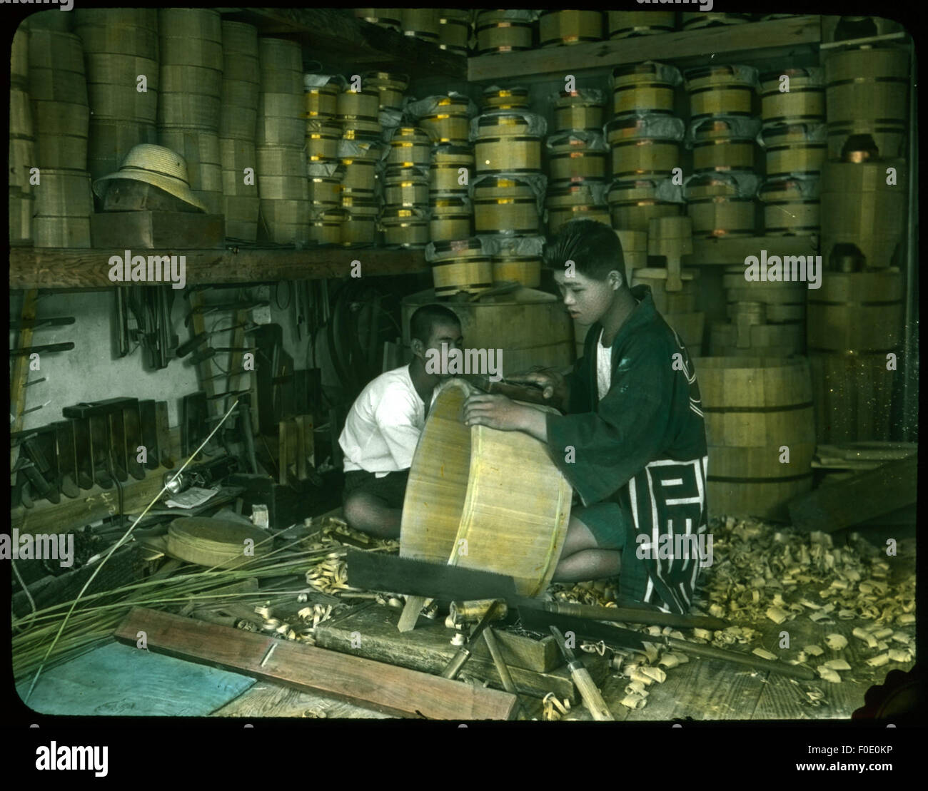 A traditional craftsman making wooden barrels, a skill passed down ...