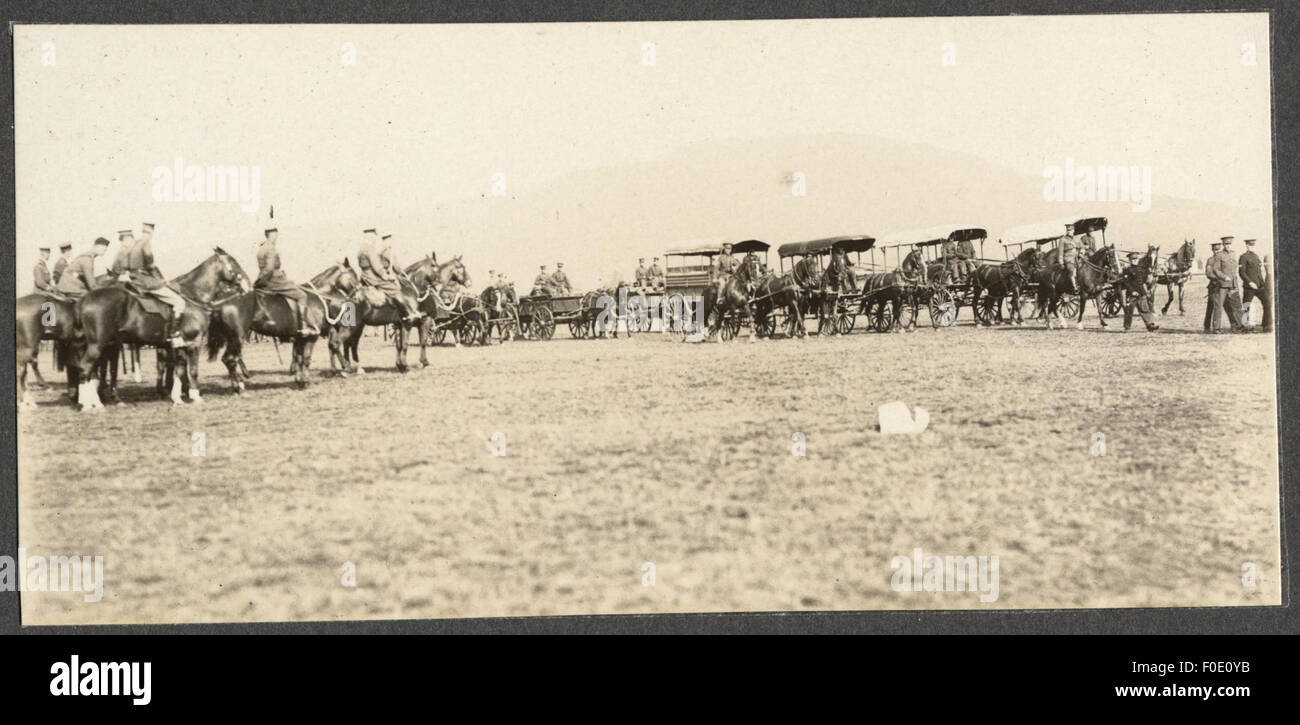A historical scene depicting wagons passing in review, likely part of a ...
