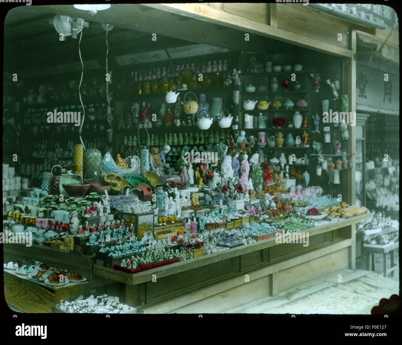 This image shows an open-air ceramic shop, where pottery and ceramic ...