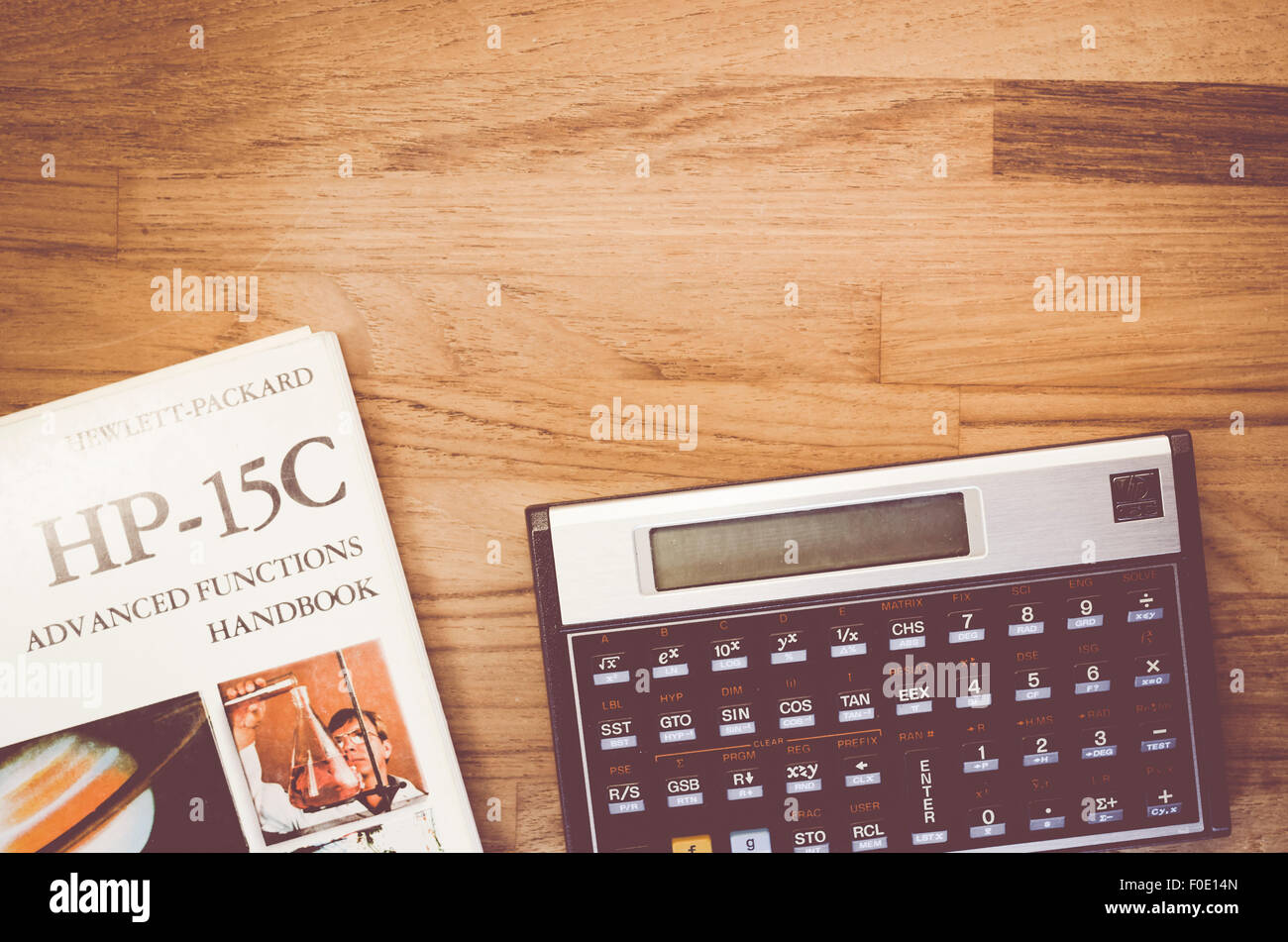 HP-15C Hewlett-Packard rpn scientific calculator and manual on a ...