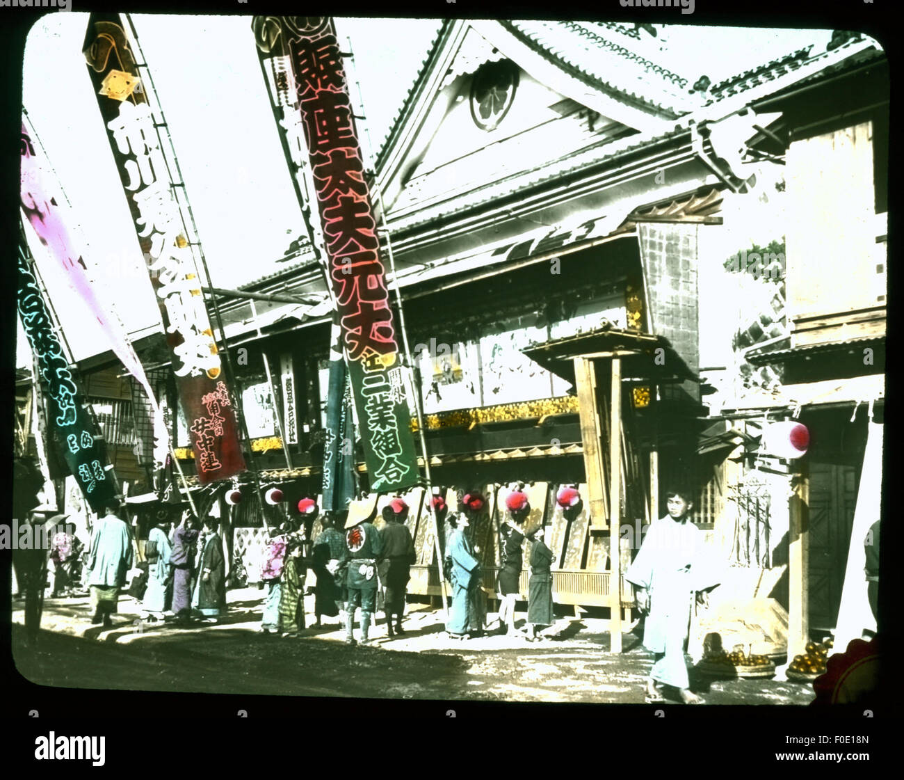 A photograph depicts people in traditional dress standing outside a ...