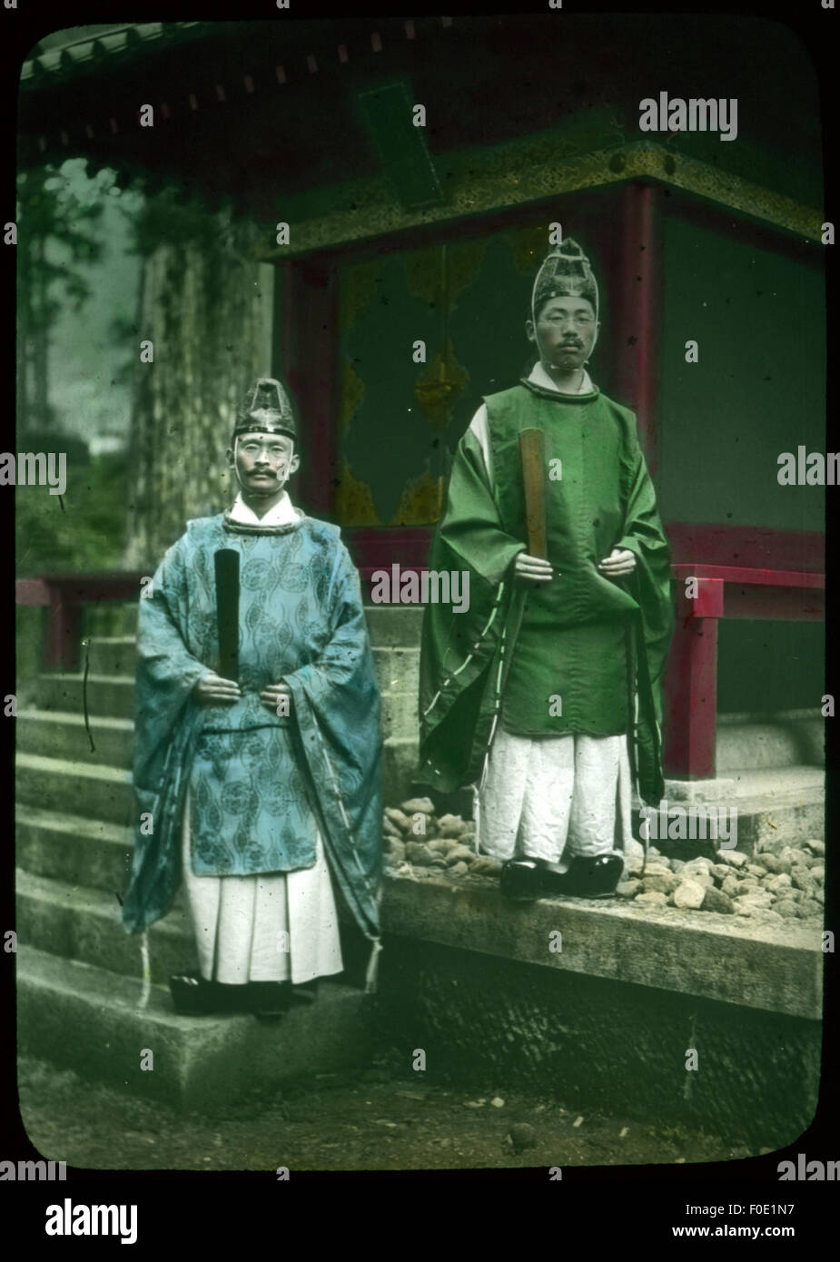 Two (priests) outside shrine Stock Photo - Alamy