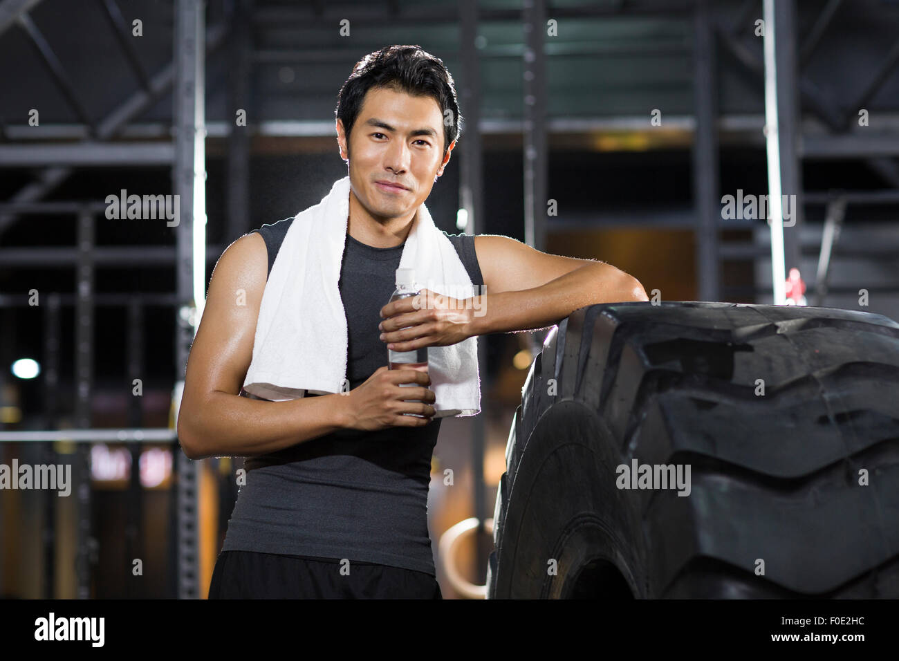 Young man resting at gym Stock Photo - Alamy