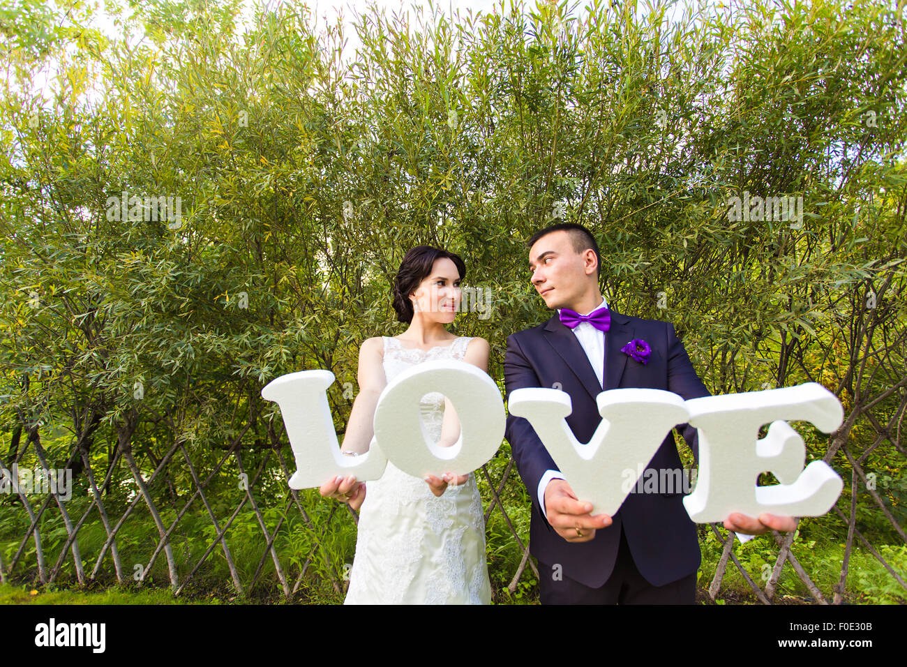 bride and groom with word Stock Photo - Alamy