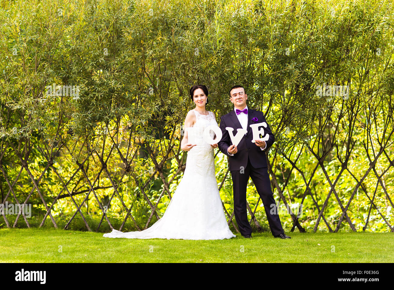 bride and groom with word Stock Photo - Alamy