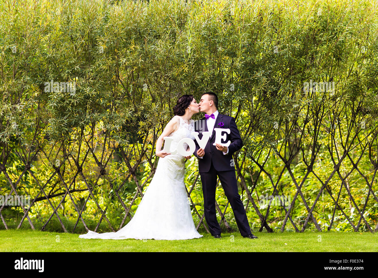bride and groom with word Stock Photo - Alamy
