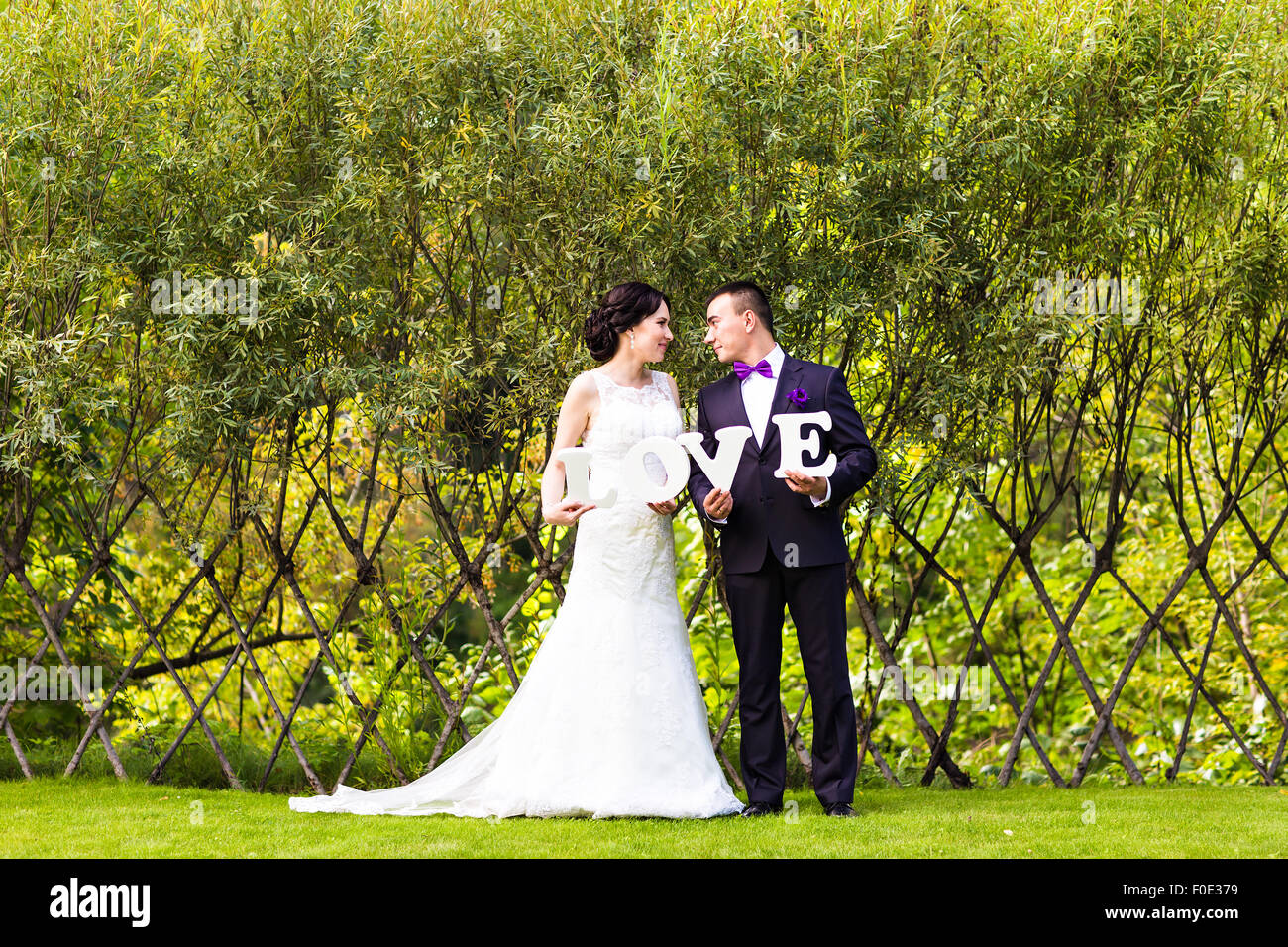 bride and groom with word Stock Photo - Alamy