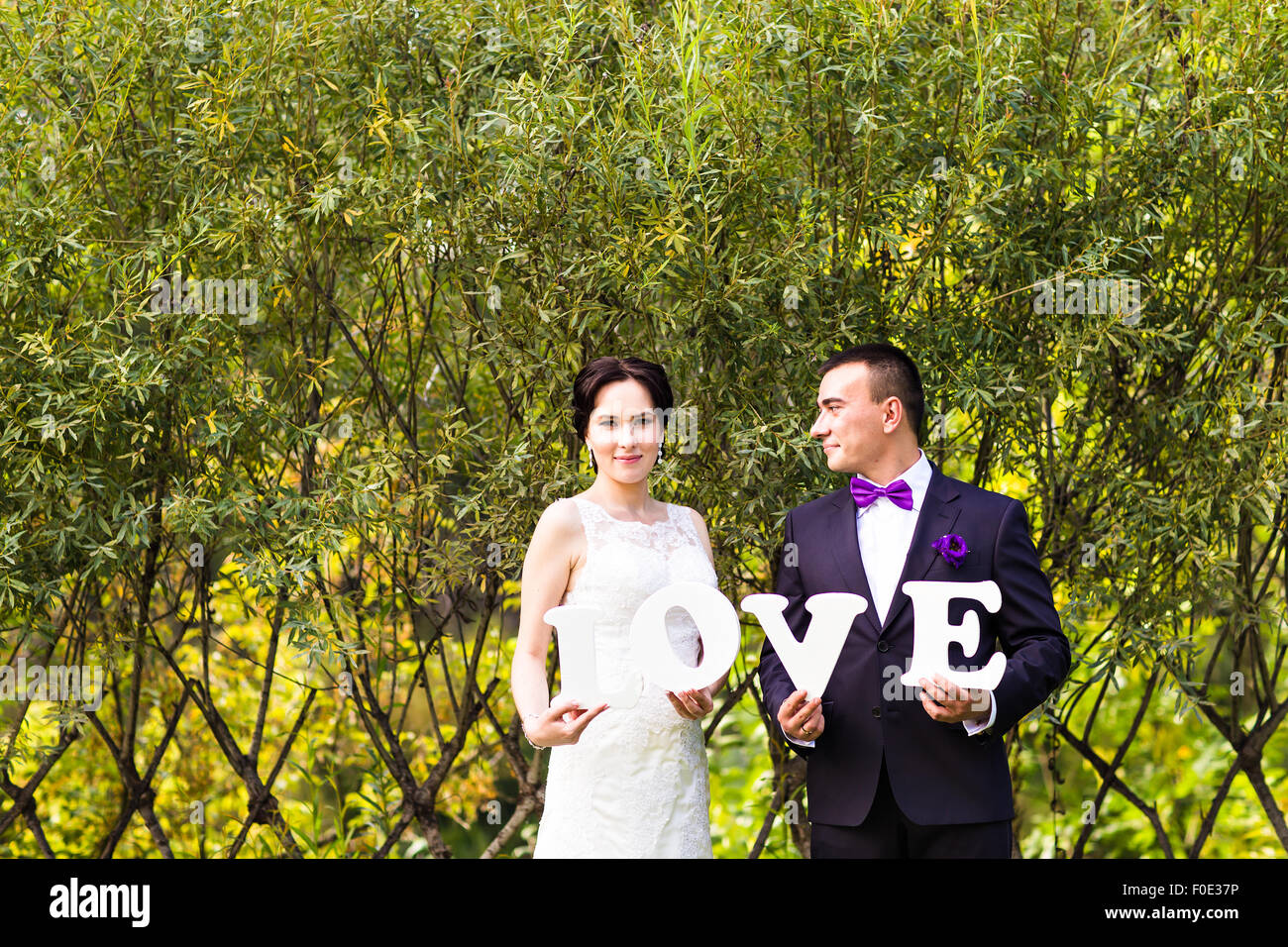 bride and groom with word Stock Photo - Alamy