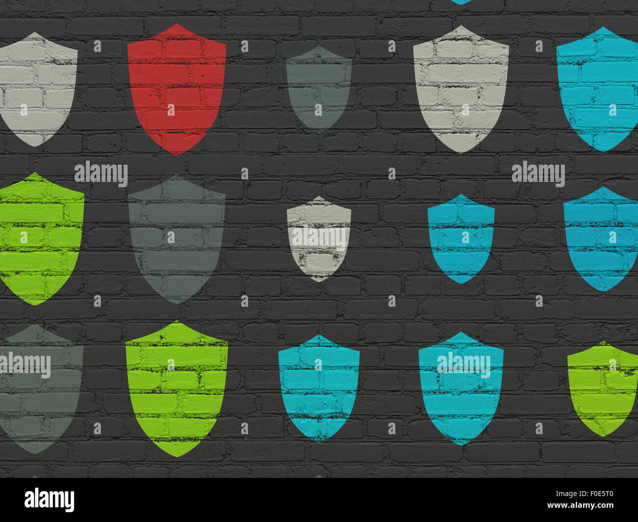 Security concept: Shield icons on wall background Stock Photo - Alamy