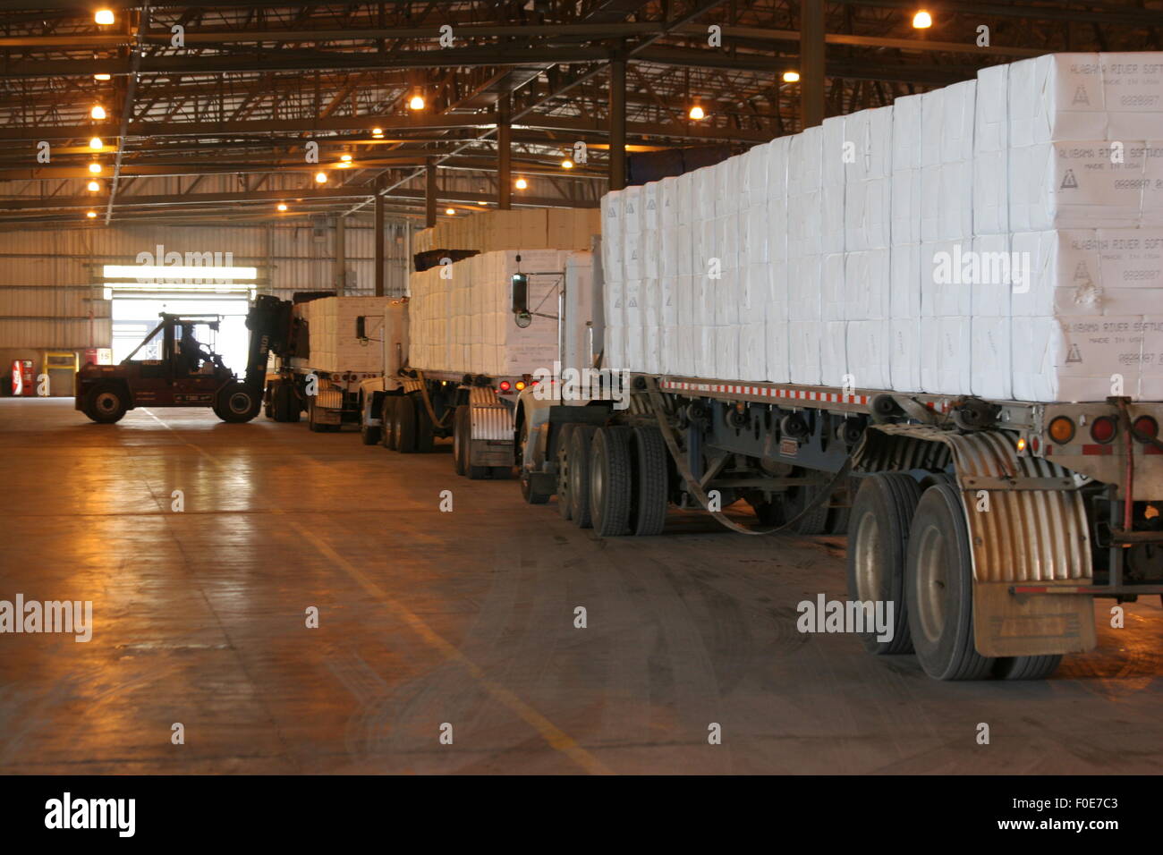 trucks being loaded in warehouse Stock Photo - Alamy