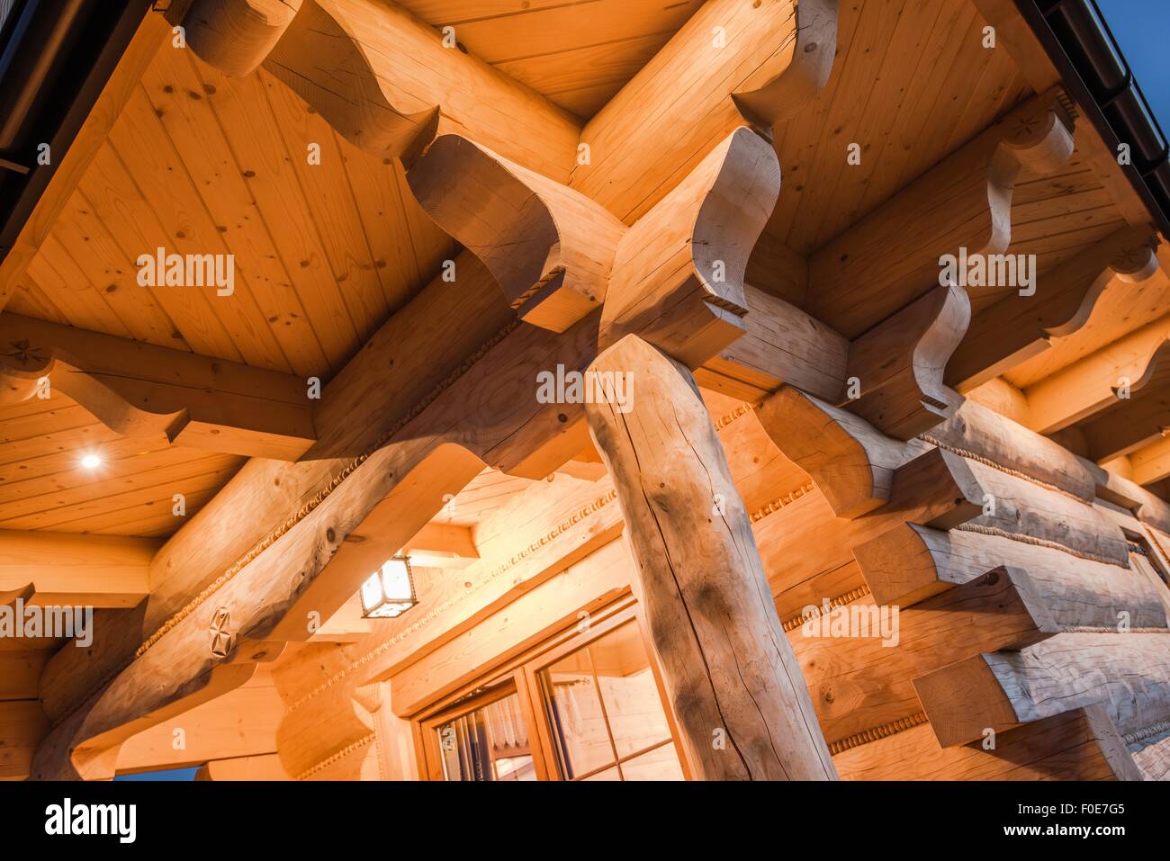 Illuminated Log Cabin Closeup. Wooden Cabin Stock Photo - Alamy