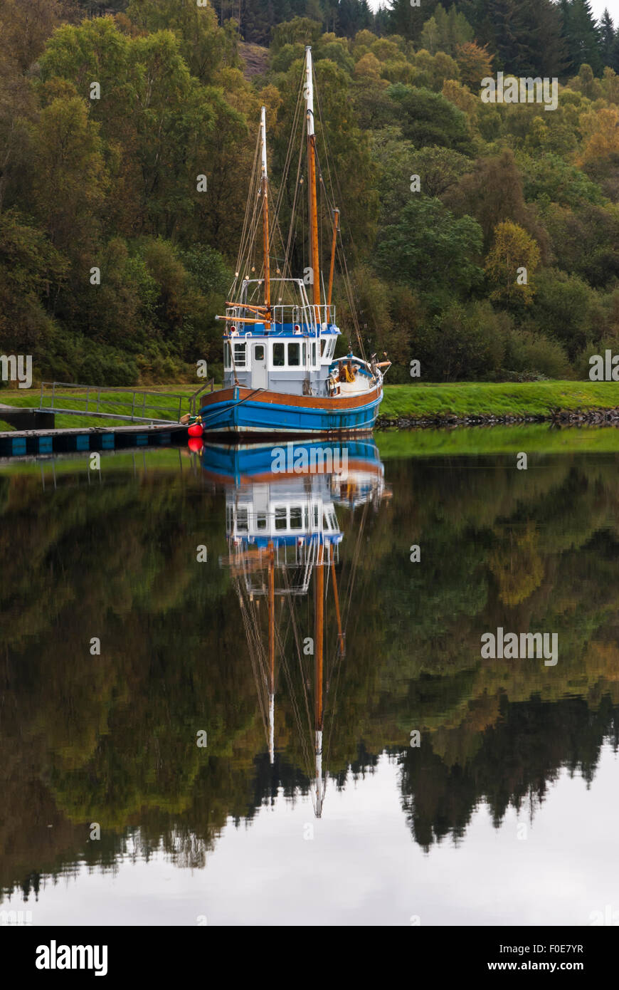 A portrait photograph of a pleasure boat moored on the Caledonian canal ...